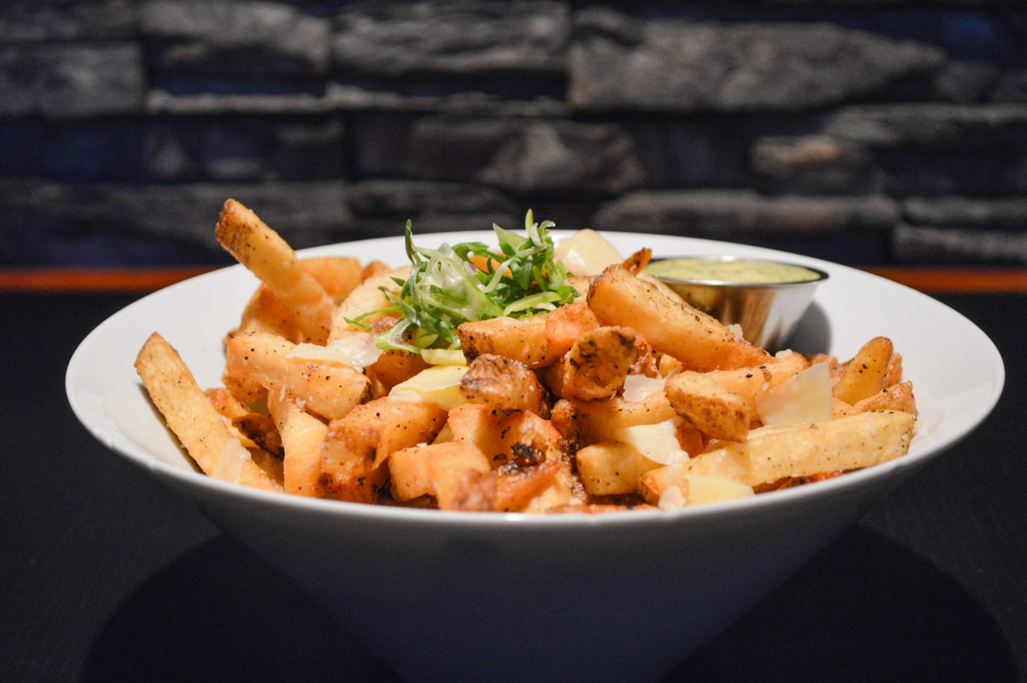 our hand cut kennebec fries tossed with parmesan, cracked pepper ...